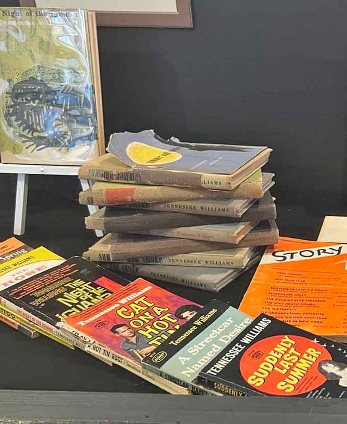 Stacked volumes of Williams' works create a literary tower of power, from "The Glass Menagerie" to "Cat on a Hot Tin Roof," proving one man's typewriter changed American theater forever.