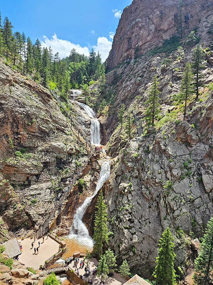 Seven Falls cascades dramatically through ancient rock formations, creating a natural amphitheater where water performs its timeless symphony.