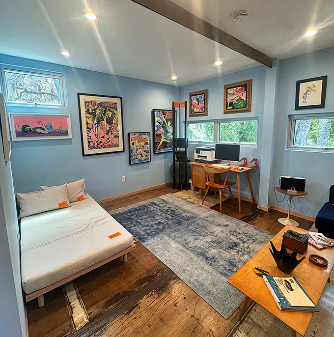 Serene blue walls and natural light transform this former cargo carrier into a peaceful retreat where dreams of sustainable living come true.