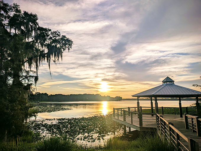 Sunset transforms the gazebo into a postcard-perfect spot, where even smartphone photographers become temporary artists.