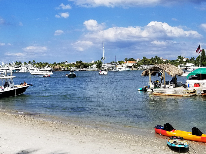 Luxury yachts dot the azure waters surrounding the island, creating a scene that's equal parts nautical playground and millionaire's row.