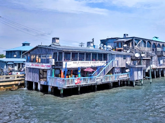 Dinner with a splash! These weathered wooden restaurants hover over the Gulf like hungry pelicans, serving seafood practically jumping from the water.