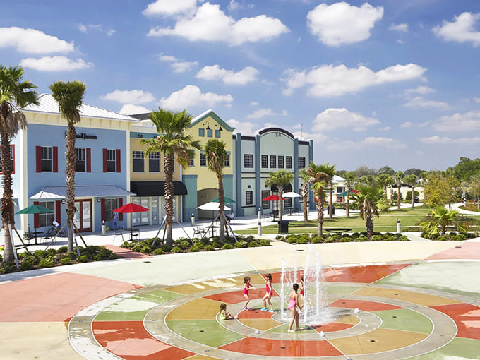 Colorful town center buildings and splash pads prove modern communities can be both practical and delightfully whimsical for families.