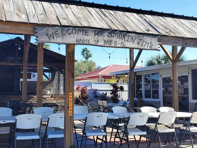 Smokin' Jim's rustic wooden entrance sign welcomes hungry visitors to their "House of Bar-B-Q" in Auburndale.