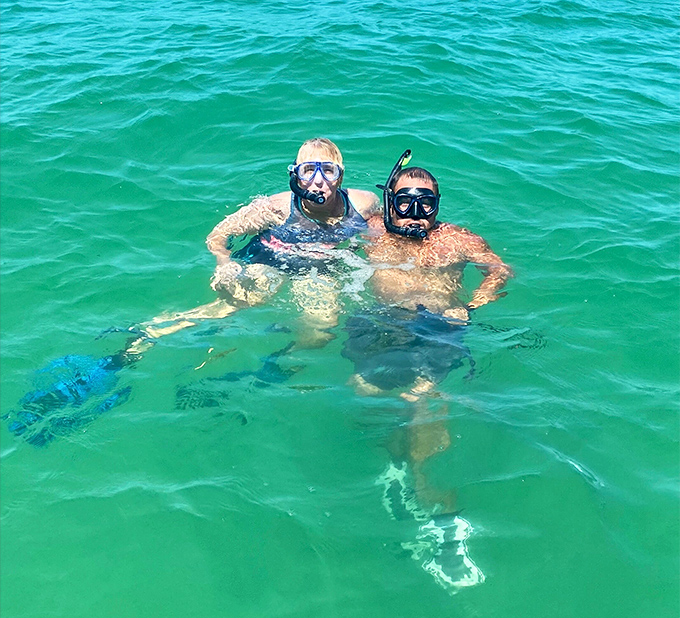 Two happy snorkelers take a breather in Florida's emerald waters. With visibility this good, you'll spot more fish than in your local seafood market &ndash; but these ones are still swimming!
