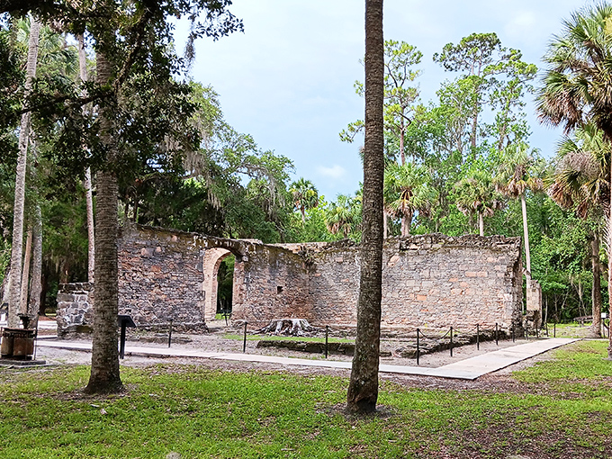 Palm trees stand guard over honey-colored stone walls, the remains of a plantation where sugar was once king and fortunes were made and lost.