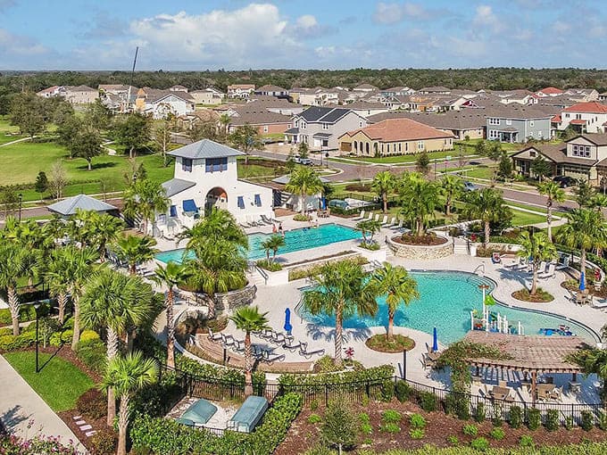 Multiple pools nestled among palm trees show how Florida neighborhoods turn everyday living into permanent vacation mode for residents.