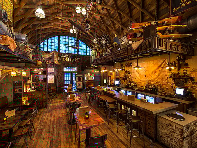 High wooden beams and walls adorned with adventure gear create the perfect atmosphere for would-be explorers to enjoy drinks and bites at this themed bar.