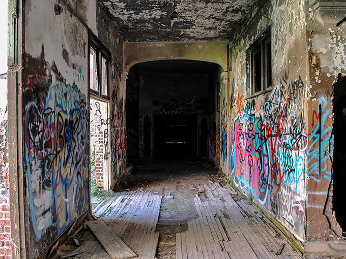 These hallways once echoed with locker slams and running feet, now they're galleries for street artists who found their canvas in abandonment.