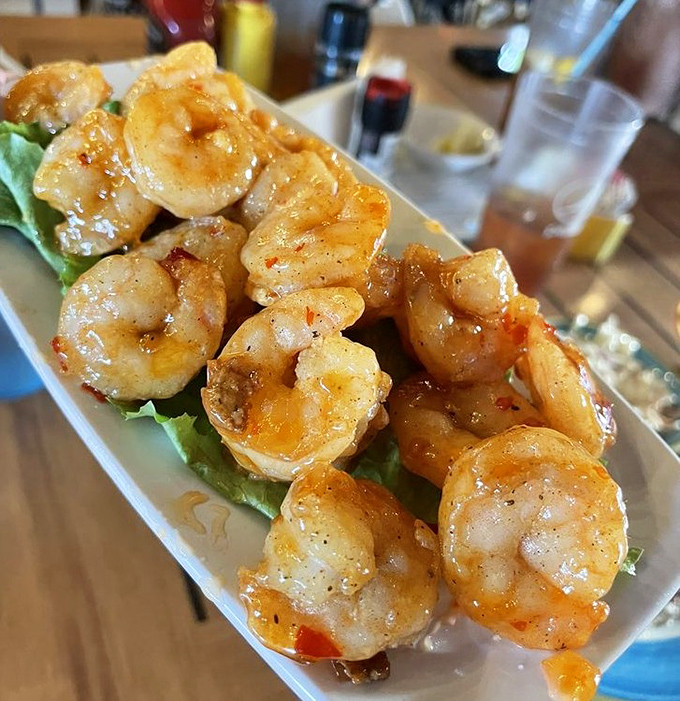 These Bang Bang Shrimp aren't just cooked&mdash;they're transformed. Plump, glistening with sauce, and arranged like culinary jewelry on their throne of lettuce.
