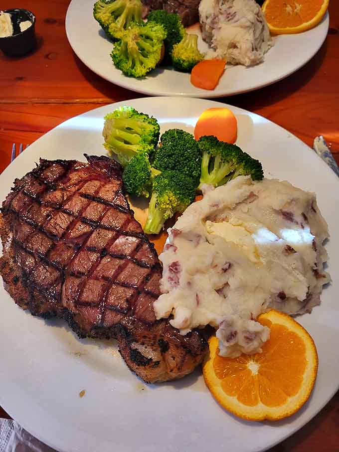 That perfectly grilled steak with creamy mashed potatoes and bright green broccoli is comfort food elevated to an art form worth celebrating.