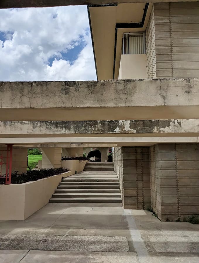 The Science Building showcases Wright's textile blocks catching Florida sunshine, turning functional walls into sculptural art that breathes.
