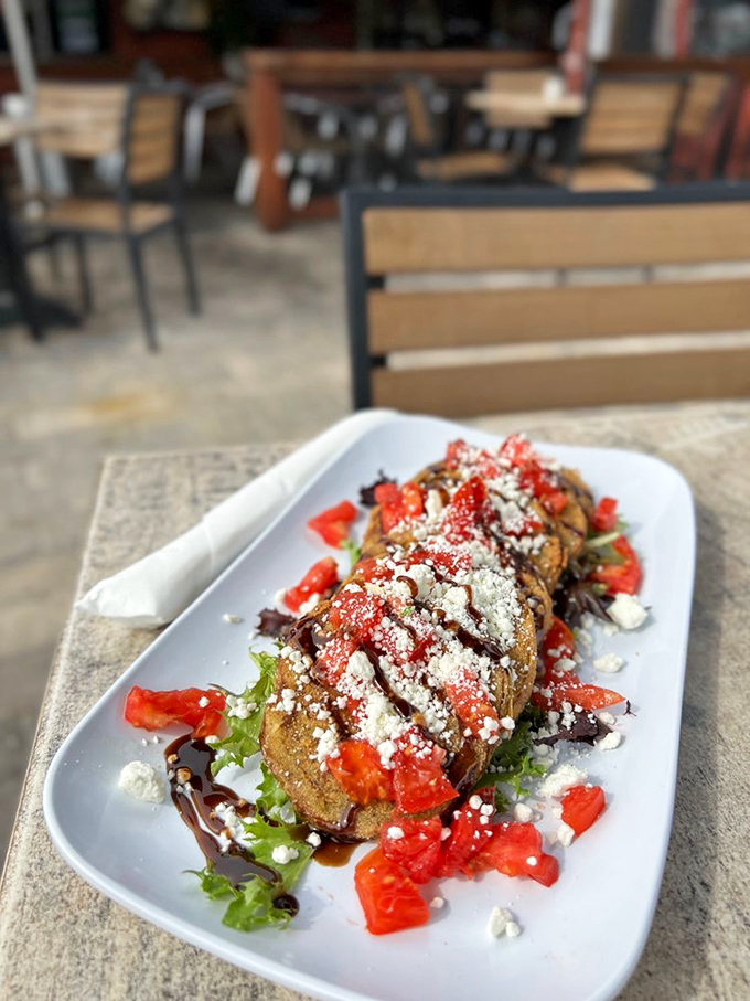 Fried green tomatoes topped with bacon, goat cheese, and cilantro prove that Southern classics get even better when you pile on the good stuff.