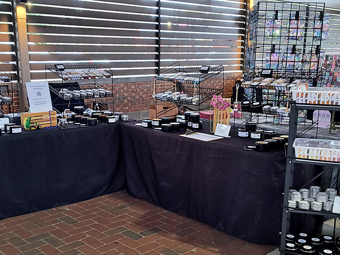 Handcrafted candles and accessories line this vendor's table &ndash; each item telling a story of creativity and craftsmanship that mass production simply cannot match.