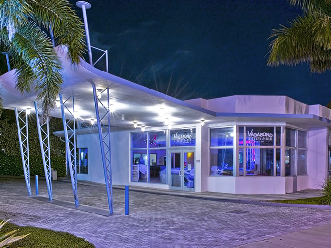 Where culinary magic happens beneath globe lights, with open shelving showcasing the tools of the trade in stylish simplicity.