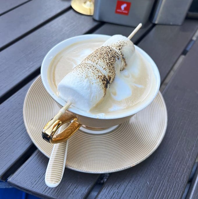This marshmallow latte isn't just a drink &ndash; it's a toasted cloud of happiness on a golden spoon.