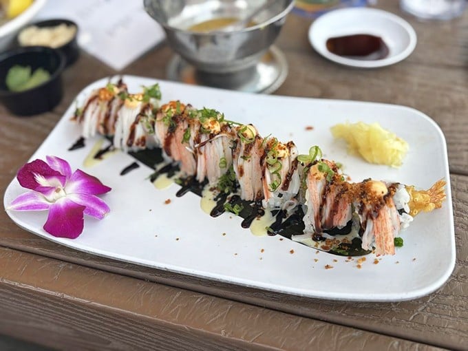 This isn't just sushi&mdash;it's edible art with a purple orchid garnish that makes you wonder if you should eat it or frame it.