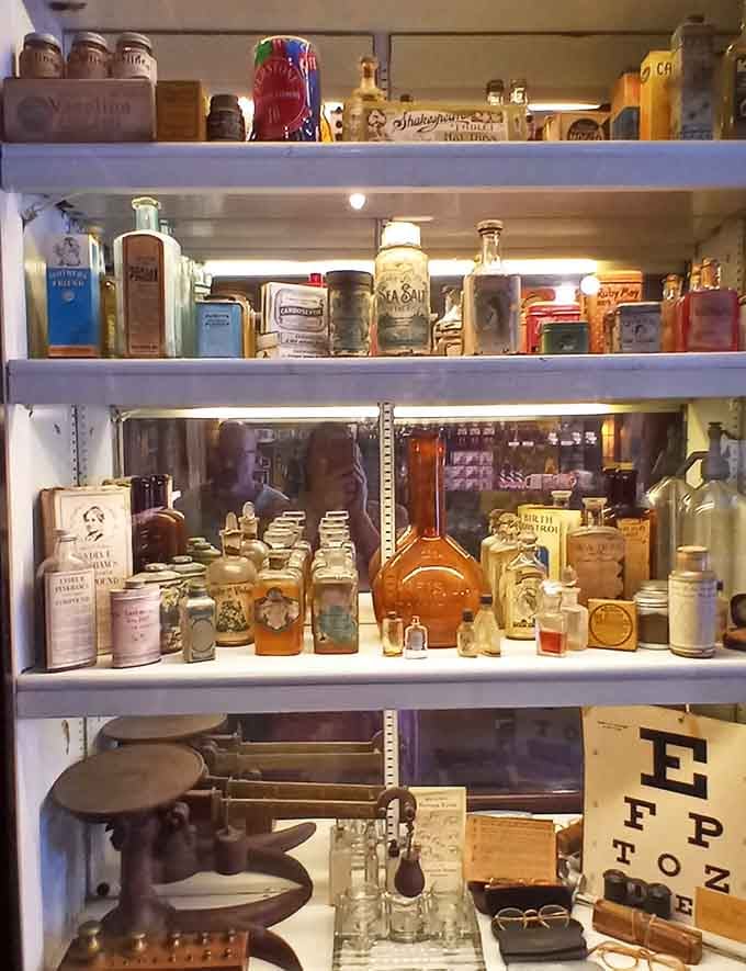 Shelves packed with vintage bottles and curiosities create a cabinet of wonders that would make any antique collector's heart skip a beat.