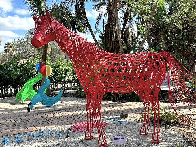 This magnificent red wire horse seems caught mid-gallop, as if racing toward some fantastic adventure that's just beyond the frame of our ordinary world.