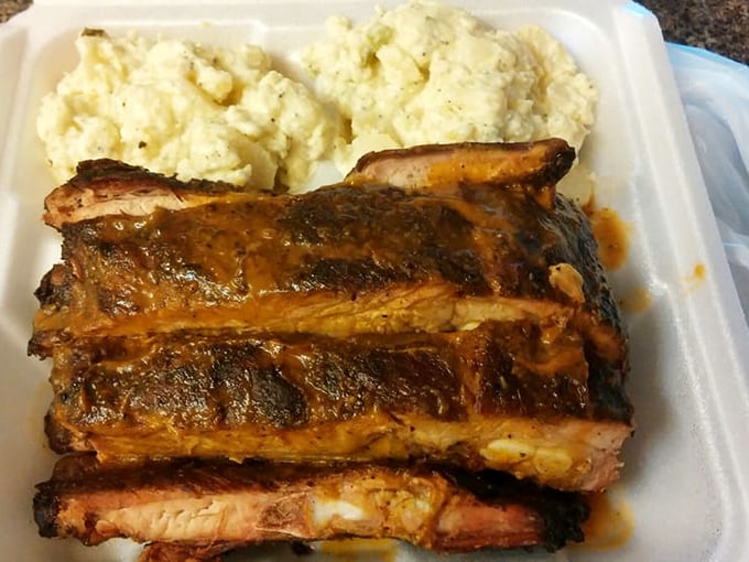 These ribs aren't falling off the bone&mdash;they're clinging to it with dignity. The perfect smoke ring tells you everything you need to know about barbecue mastery.