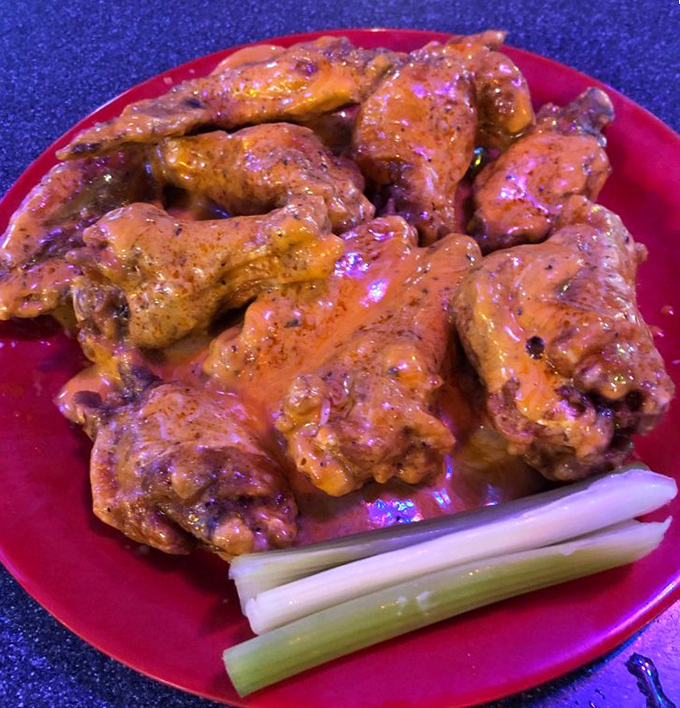 These glistening beauties pack a slow-building heat that'll make your forehead glisten. The celery sticks aren't garnish—they're necessary survival equipment.