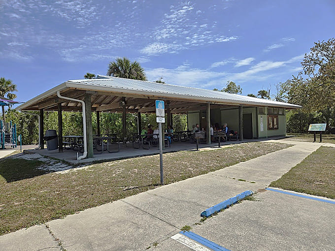 The covered pavilion stands ready to host your next family gathering, complete with shade and views that no restaurant can match.
