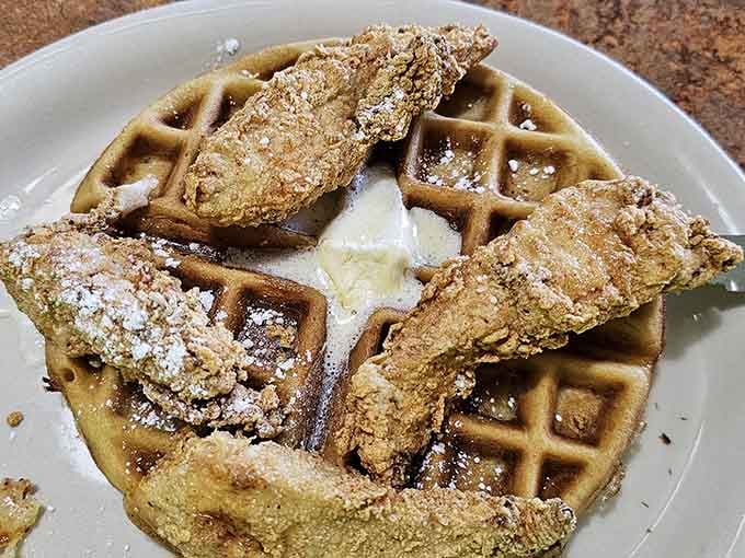 Chicken and waffles achieving perfect harmony, like if breakfast foods formed a band and actually stayed together for the whole tour.