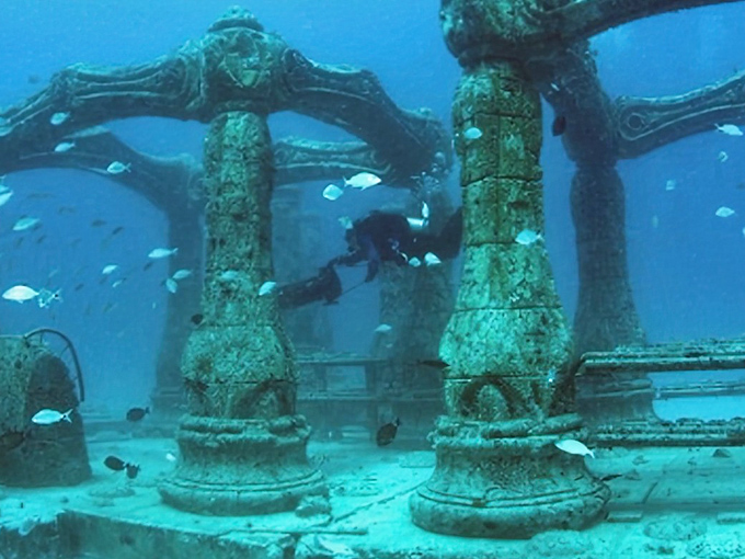 Sunlight filters through these majestic underwater arches, creating a cathedral-like atmosphere that makes even the most chatty diver fall silent in awe.
