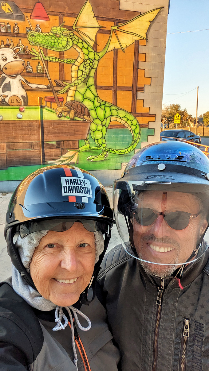 Even the motorcyclists stop to appreciate art in Lake Placid. The town's murals attract visitors from all walks of life seeking colorful stories.
