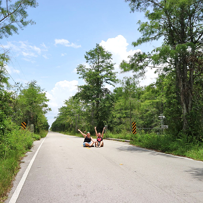 Adventurous travelers pause to celebrate the journey, finding joy in the middle of nowhere that somehow feels exactly like somewhere special.