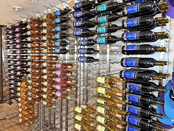 Wine bottles stand at attention like colorful soldiers, each waiting for their chance to make your acquaintance.