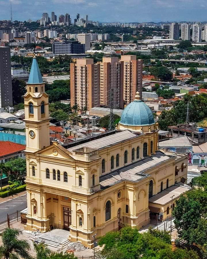 This aerial view showcases the architectural beauty of a historic church, its golden dome gleaming like a crown jewel.