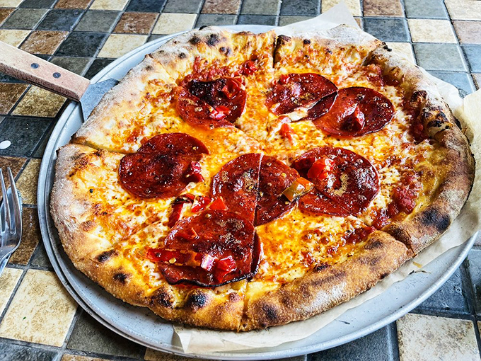 Those curled-up pepperoni cups are little flavor pools of joy, cradling their spicy oils atop perfectly melted cheese.