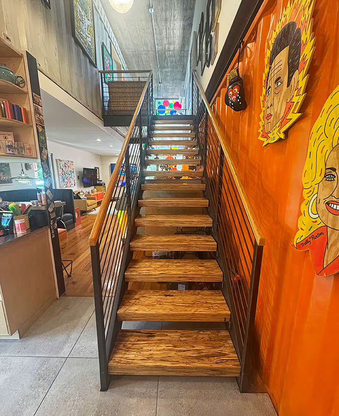 Not just steps but a journey through art – this orange-walled stairway gallery proves even transitional spaces deserve the spotlight.