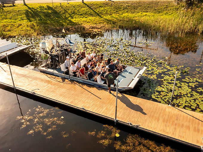 Visitors gather excitedly aboard an airboat, about to experience the Everglades up close &ndash; some smiling, others wondering what they've gotten themselves into.