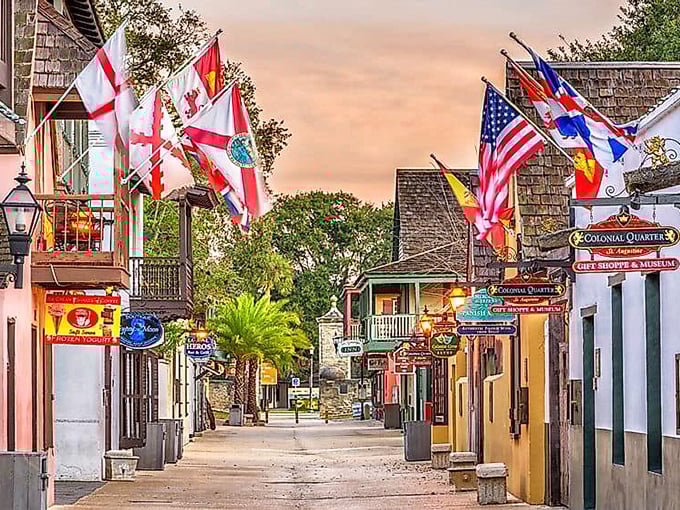 Flags flutter like confetti! St. Augustine's historic lane glows with twilight magic and centuries-old stories.