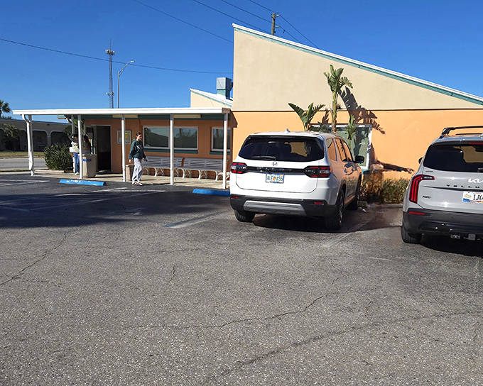 This simple wooden building with an American flag is home to Slim's Bar-B-Q, where BBQ traditions are honored with every plate.