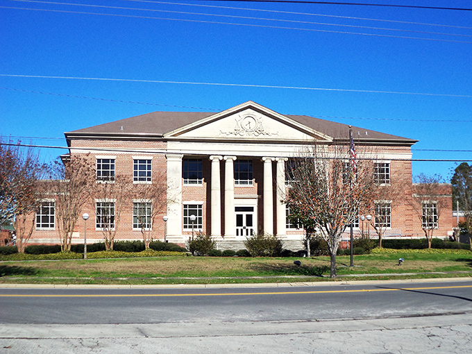 Baker County Courthouse commands respect with its classical columns and brick fa&ccedil;ade &ndash; Southern dignity in architectural form.