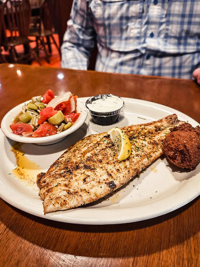 Blackened redfish, perfectly seasoned with a spice crust giving way to flaky, moist fish &ndash; Florida seafood at its simple, unadulterated best.