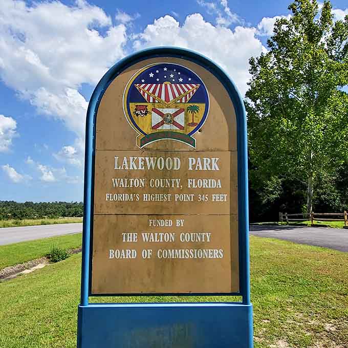 The official park signage proudly proclaims this geographical distinction, funded by folks who understand that every state needs a highest point, even if it's basically a gentle bump.