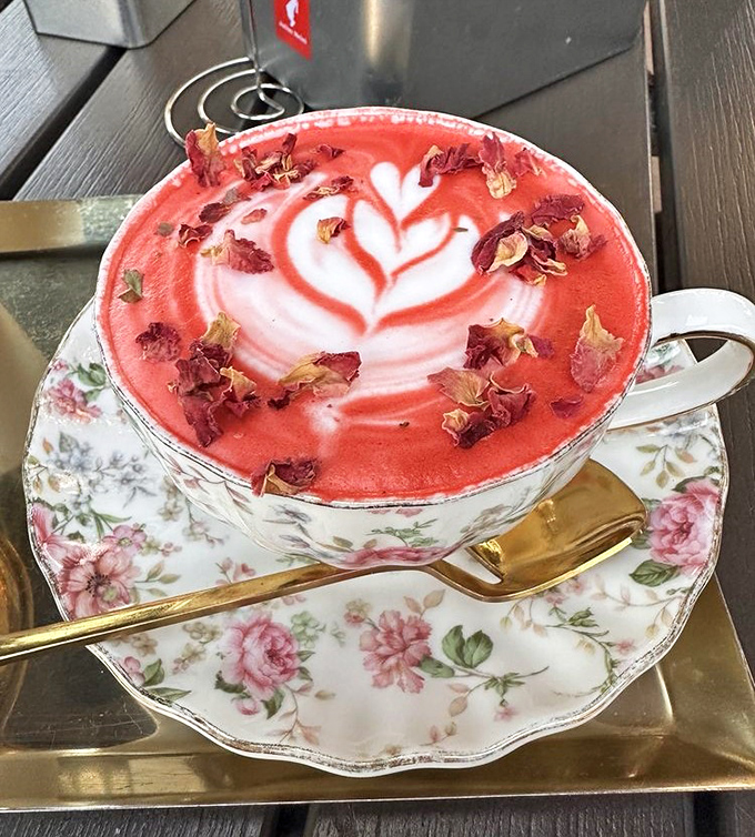 The Casa Rosada latte blooms with rose petals and artful foam &ndash; coffee elevated to botanical artwork.