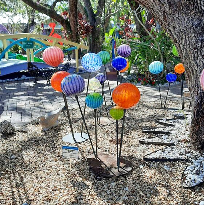 Glass orbs rise from the ground like lollipops planted by a giant with excellent taste in garden decor&mdash;proof that Florida sunshine looks best when filtered through art.