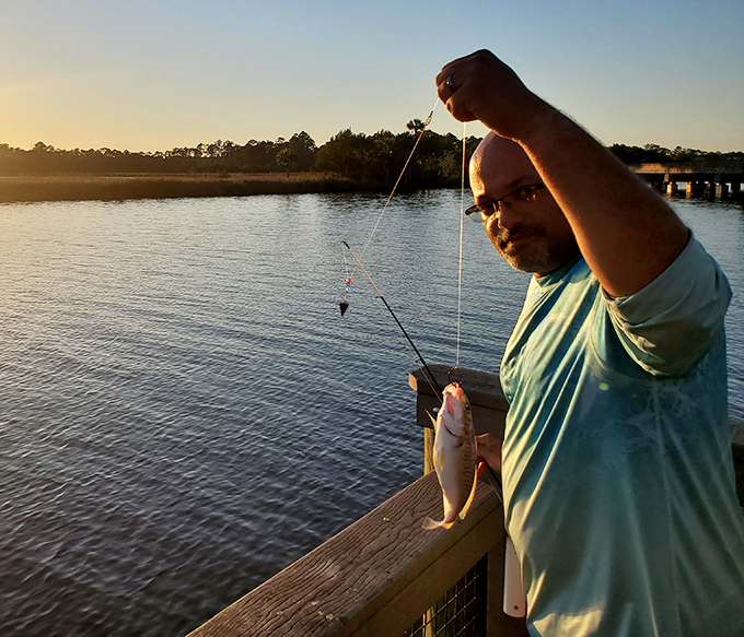 That moment when dinner dangles from your line and you realize why they call fishing "the contemplative man's recreation" &ndash; pure Florida bliss!