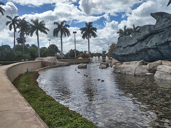 Reflective waters mirror the epic battle, doubling the visual impact while palm fronds dance in gentle Florida breezes.