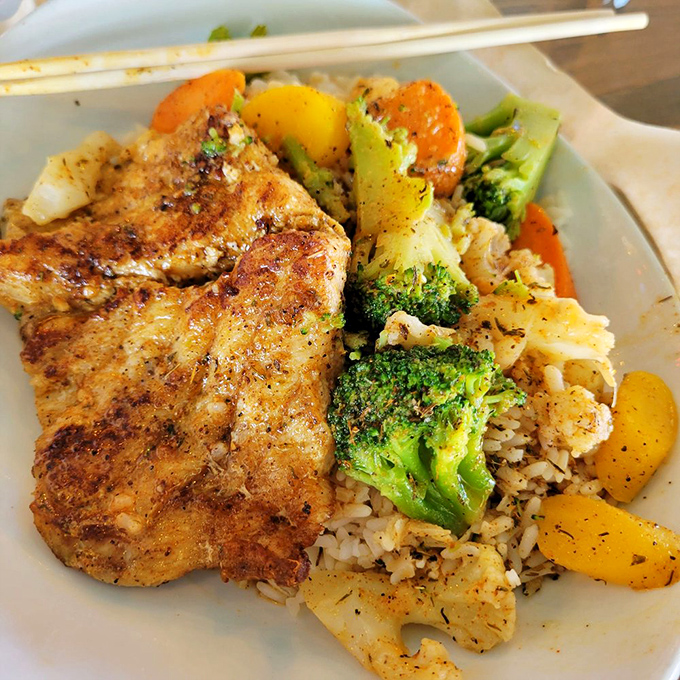 Fresh-caught grouper meets colorful veggies atop a bed of rice&mdash;proof that healthy eating doesn't have to sacrifice an ounce of flavor.
