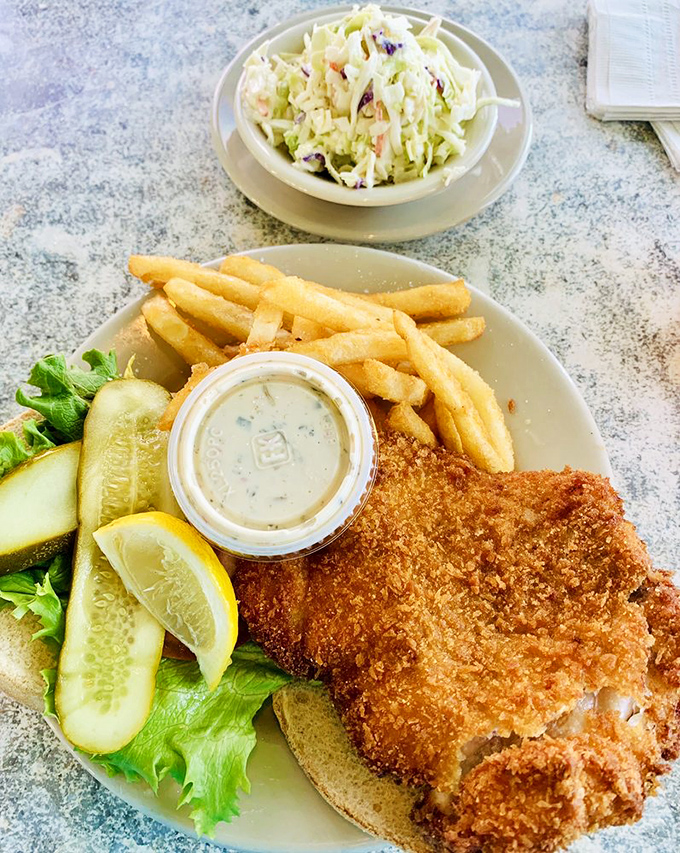 The grouper sandwich arrives like a celebrity &ndash; perfectly cooked fish on a pillowy bun with just enough crisp veggies.