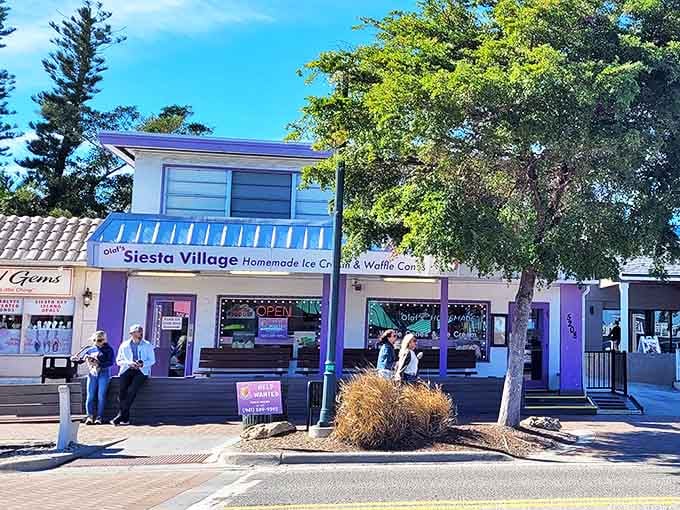 Olaf's Siesta Village Ice Cream stands as a blue-and-white beacon of frozen salvation for sun-soaked visitors seeking sweet relief.
