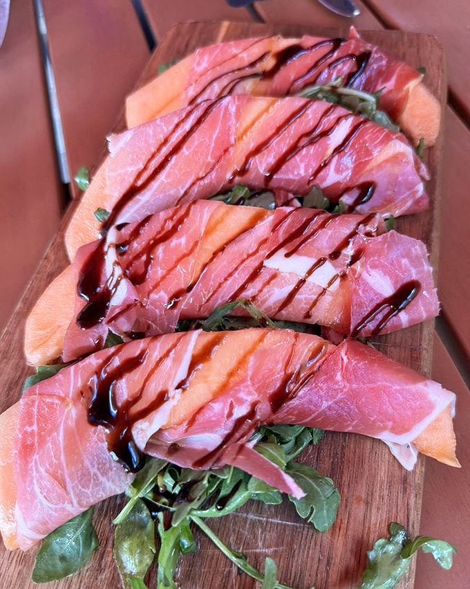Prosciutto e Melone &ndash; where paper-thin salty ham drapes over sweet melon like nature's perfect flavor tango.