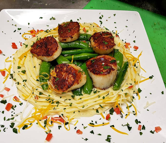 Perfectly seared scallops perch atop a nest of pasta and snap peas &ndash; proof that sometimes the simplest preparations let great ingredients shine brightest.