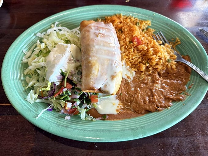 The shredded chicken chimichanga achieves that perfect golden exterior while keeping everything tender and flavorful inside, proving fried food is indeed an art form.